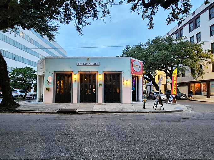 The vibrant red exterior of The Prytania Bar beckons like a culinary lighthouse in New Orleans' Garden District. Those black doors? They're portals to fish and chips paradise.