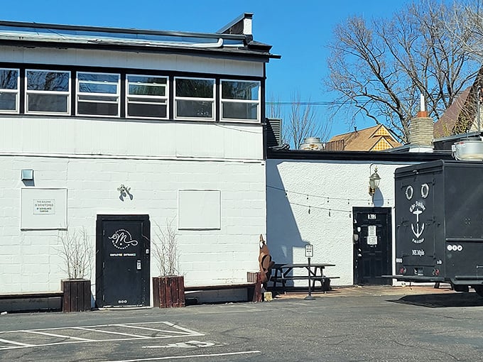 The classic black and white signage of The Anchor Fish & Chips stands as a beacon of British comfort food in Northeast Minneapolis.