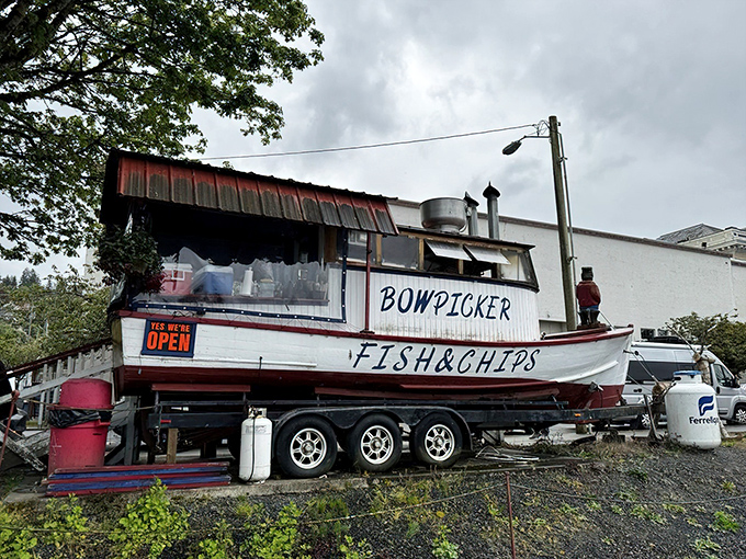 The legendary Bowpicker stands proudly on land, a fishing vessel that found its true calling serving up Astoria's most coveted seafood treasure.