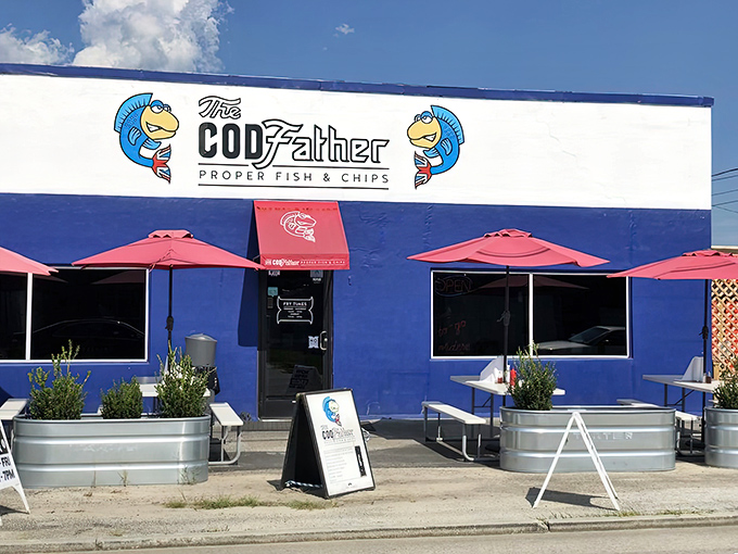 The bright blue exterior of The CODfather stands like a British embassy on American soil, complete with cartoon fish mascots making an offer you can't refuse.