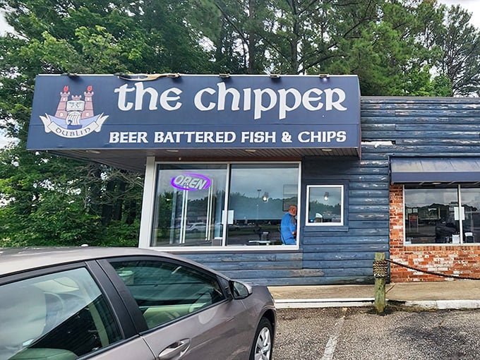 The blue wooden exterior of The Chipper stands like a portal to Britain, promising authentic beer-battered treasures within its unassuming walls.