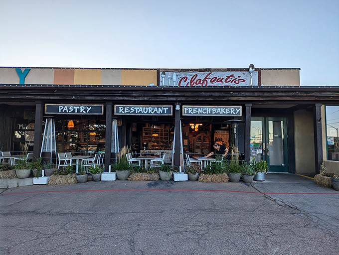 The unassuming exterior of Clafoutis beckons like a French postcard come to life, complete with charming patio seating perfect for people-watching with your pain au chocolat.