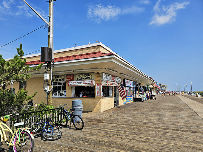 The unassuming yellow-brick exterior of Gus & Gus Place stands as a Rehoboth Beach landmark, proudly serving boardwalk classics since the Eisenhower administration.