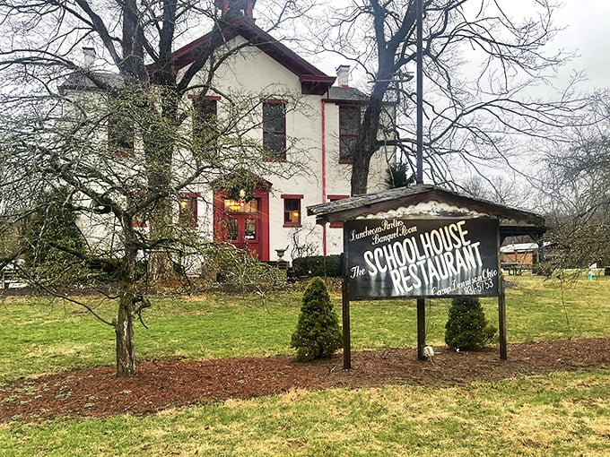 The iconic white schoolhouse with its red trim and bell tower stands as proof that sometimes the best restaurants come with homework&mdash;of the delicious variety.