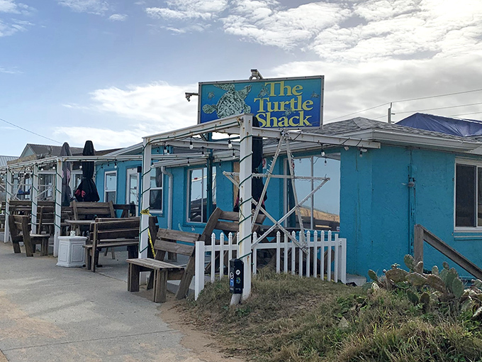 The vibrant turquoise exterior of Turtle Shack Cafe stands out like a beacon for hungry travelers. Florida coastal dining at its unpretentious best.
