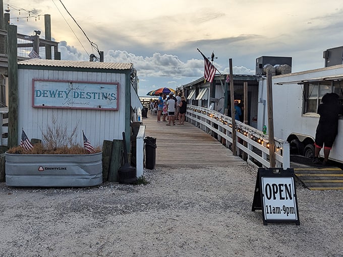 The entrance to seafood paradise begins with this unassuming wooden walkway. Like all great Florida treasures, Dewey Destin's doesn't need to shout about its brilliance.