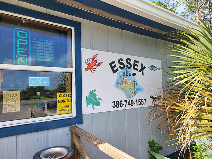 The blue-roofed beacon of seafood salvation sits unassumingly in Pierson, promising "Famous Fried Clams" that have seafood pilgrims filling the parking lot daily.