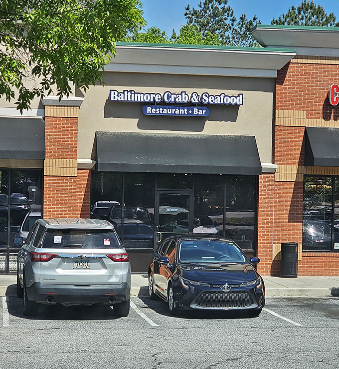 The blue neon sign beckons like a lighthouse for seafood lovers. Maryland magic awaits inside this Atlanta treasure.