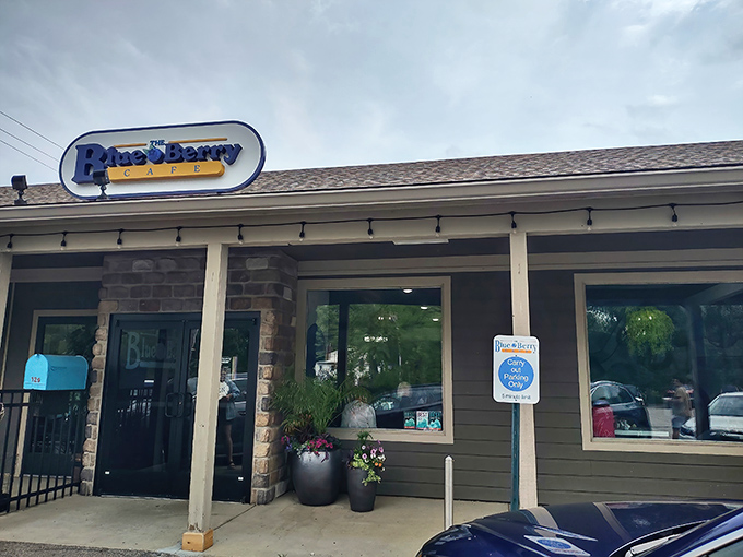 The unassuming exterior of The Blue Berry Café might fool you, but those filled parking spots tell the real story—breakfast treasures await inside this Bellbrook gem.