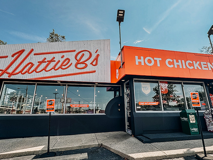 The iconic red script against white beckons like a siren song to heat-seekers. This Nashville landmark promises pleasure and pain in equal measure.