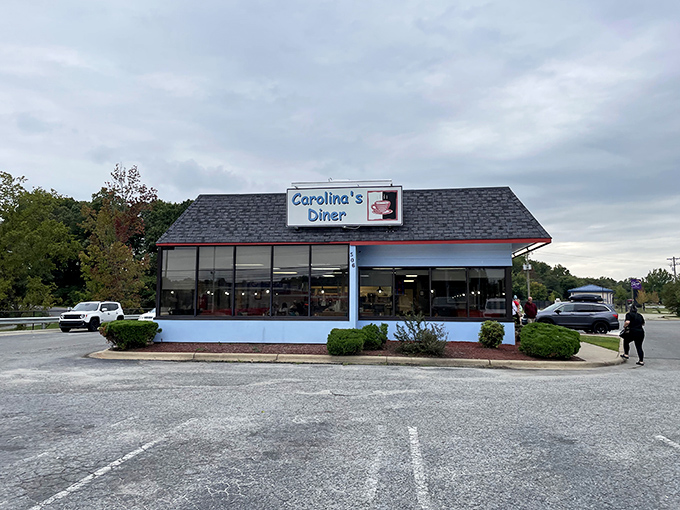 The blue-trimmed exterior of Carolina's Diner stands like a beacon of breakfast hope against the North Carolina sky. Comfort food paradise awaits!