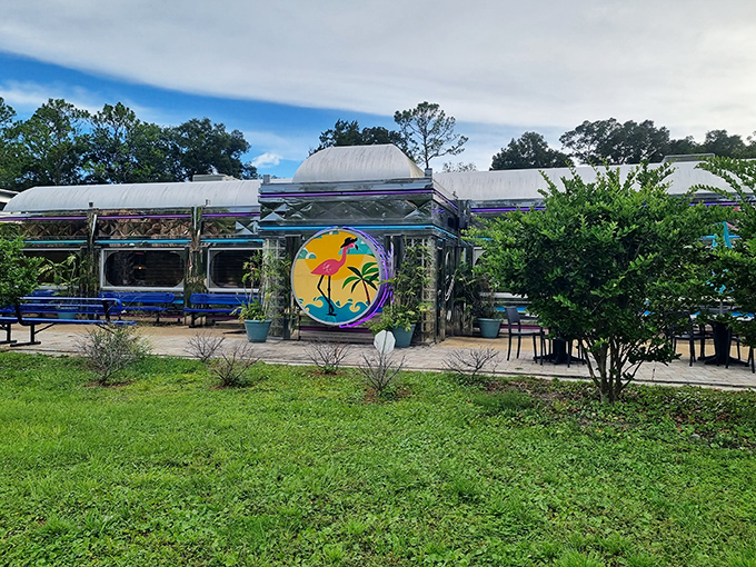 The Pink Flamingo Diner stands proud against Florida's skyline, where palm trees and retro signage promise a journey back to simpler, tastier times.