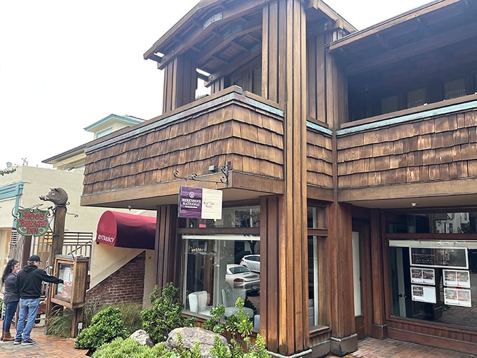 The rustic wooden exterior of Hog's Breath Inn welcomes you like an old friend, its iconic sign promising culinary adventures in the heart of charming Carmel-By-The-Sea.