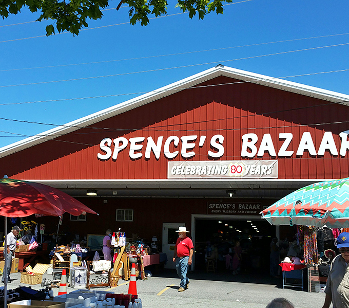 The iconic red barn of Spence's Bazaar stands like a treasure chest waiting to be opened, promising discoveries that'll make your weekend complete.