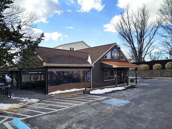 The unassuming blue exterior of Jesse's Barbecue hides culinary treasures within&mdash;like finding a diamond mine disguised as a garden shed.