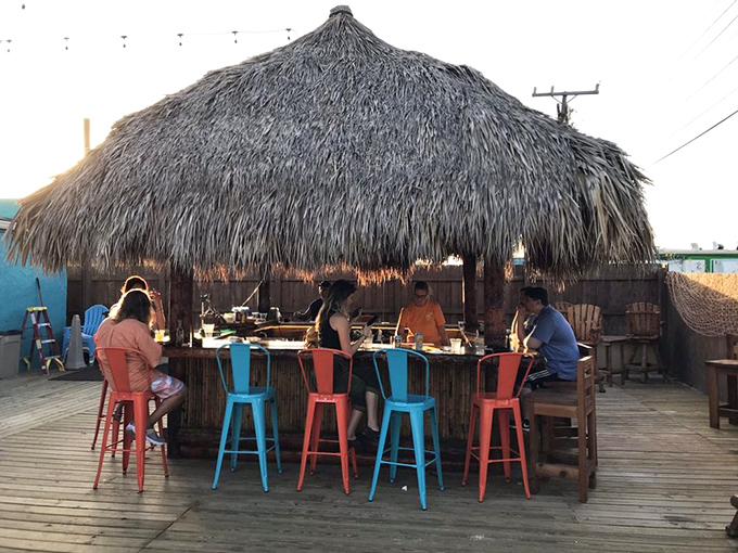 The quintessential tiki experience awaits under this meticulously crafted palm-thatched roof. Paradise isn't a place&mdash;it's this bar stool with an ocean breeze.