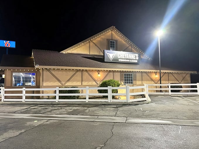 The barn-like exterior of Cheyanne's glows with inviting warmth against the night sky, like a beacon for hungry travelers on California's Highway 99.