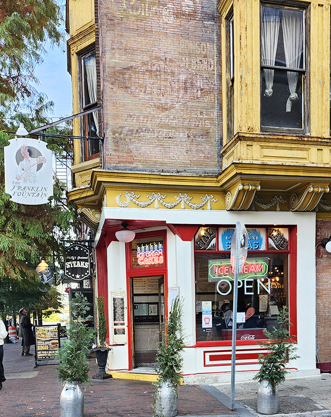 The corner of Market and Letitia Streets houses a time machine disguised as an ice cream shop. That glowing neon "OPEN" sign is Philadelphia's version of the pearly gates.