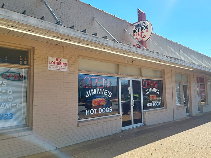 The unassuming exterior of Jimmie's Hot Dogs stands as a time capsule in Albany, complete with vintage signage and a strict "No Loitering" policy that locals respect religiously.