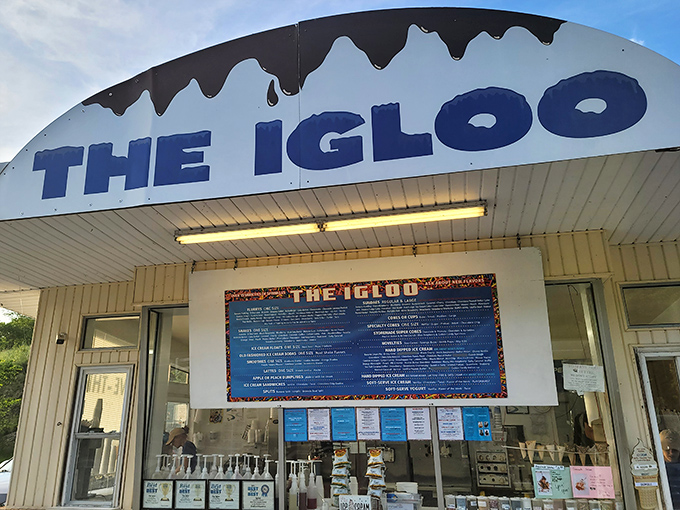 The Igloo stands like a frozen mirage in the Pennsylvania countryside, its distinctive white roof and blue lettering beckoning ice cream pilgrims from miles around.