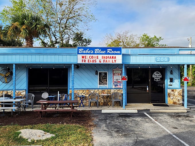The little blue building that could! Babe's Blue Room's vibrant exterior stands as a colorful beacon for hungry travelers seeking authentic Florida comfort food.