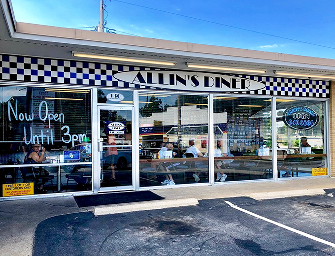 The classic black-and-white checkered awning of Allin's Diner isn't just decoration&mdash;it's a beacon calling hungry souls to pancake paradise.