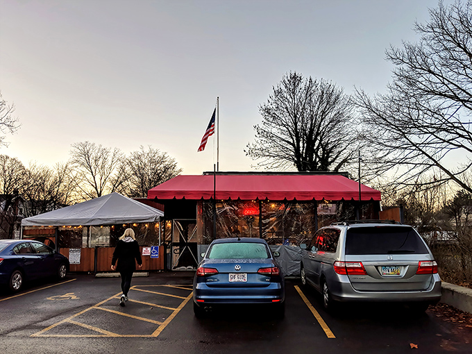 The red awning beckons like a culinary lighthouse in Grandview Heights. This unassuming entrance hides donut treasures that would make Homer Simpson weep with joy.