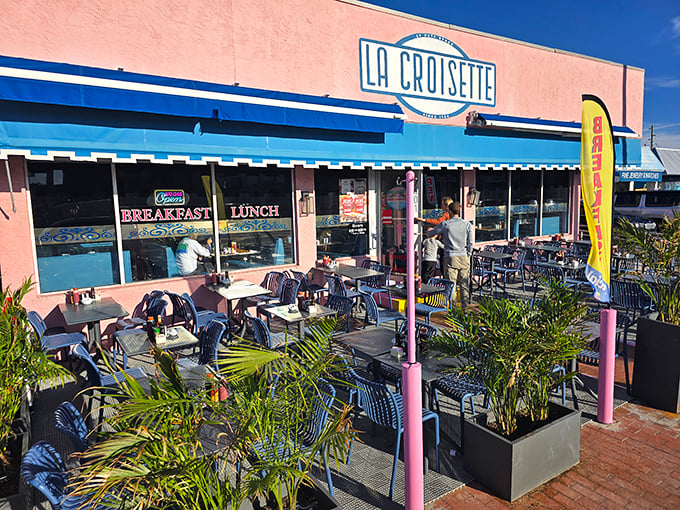 La Croisette's cheerful pink exterior with blue awnings stands out like a breakfast beacon on St. Pete Beach, promising French-inspired delights inside.