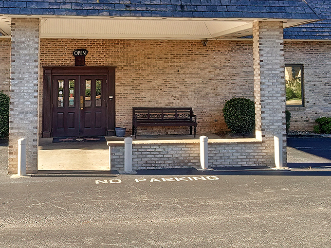 The unassuming brick exterior of Bulls Steakhouse proves once again that the most memorable meals often hide behind the most modest facades.