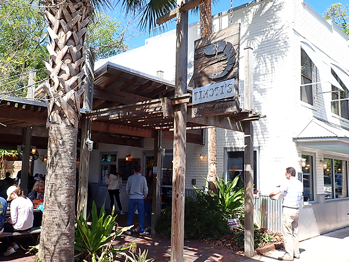 That weathered wooden shrimp sign swinging in the Florida breeze isn't just decoration&mdash;it's a beacon calling seafood lovers home to Timoti's charming Fernandina Beach location. 