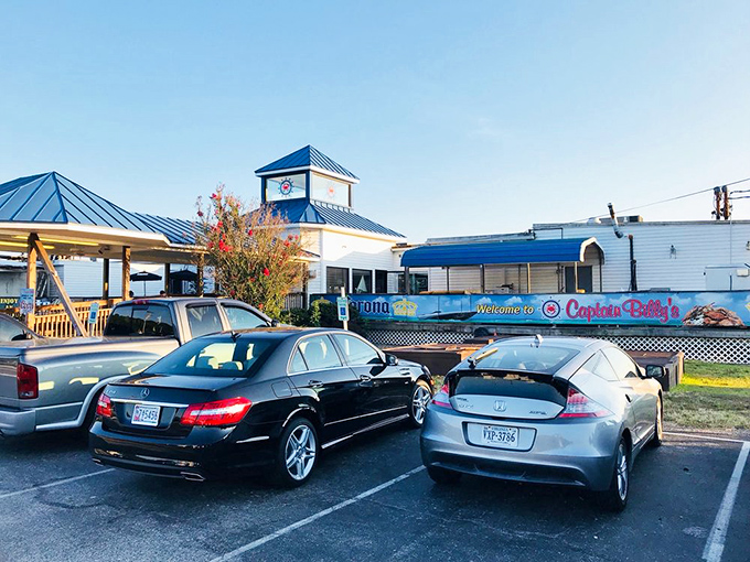 The blue-roofed beacon of seafood salvation beckons hungry travelers to Newburg's waterfront, where crab feasts and river views await.