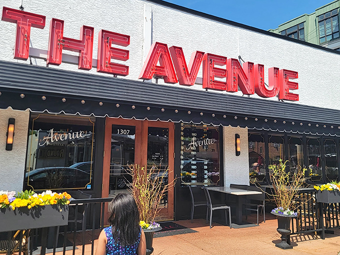 The Avenue's bold red signage against crisp white fa&ccedil;ade stands as a beacon for steak lovers. Columbus's answer to carnivorous prayers.