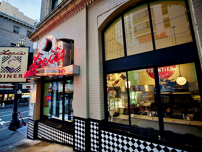 That iconic red neon sign beckons like a lighthouse for the hungry, promising a journey back to when dining was an event, not just a pit stop.