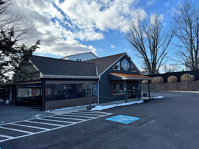 The unassuming blue exterior of Jesse's Barbecue hides culinary treasures within&mdash;like finding a diamond mine disguised as a garden shed.