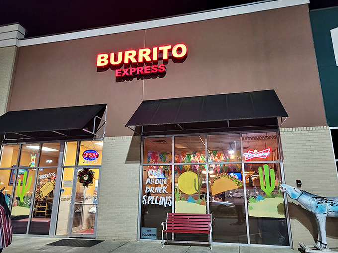 The unassuming storefront of Burrito Express, complete with wooden donkey sentinel, proves that culinary treasures often hide in plain sight.