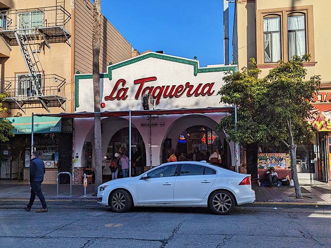 The iconic white facade with its distinctive red script beckons hungry pilgrims like a taco temple. Those arches aren't just decorative&mdash;they're gateways to burrito bliss.