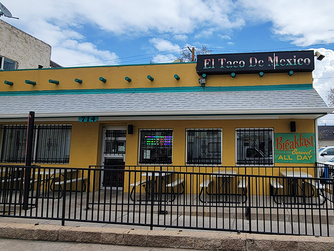 The little yellow building that launched a thousand road trips. El Taco de Mexico's vibrant exterior promises authentic delights within.