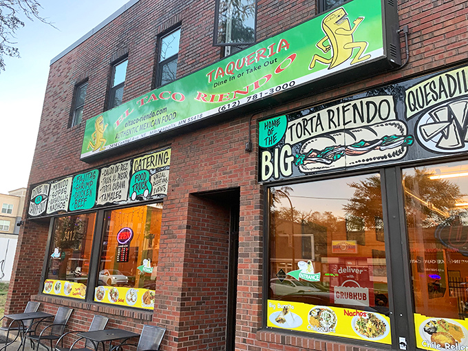 El Taco Riendo's vibrant storefront announces its presence with neon-bright menu boards that practically scream, "Yes, this is the real deal!"