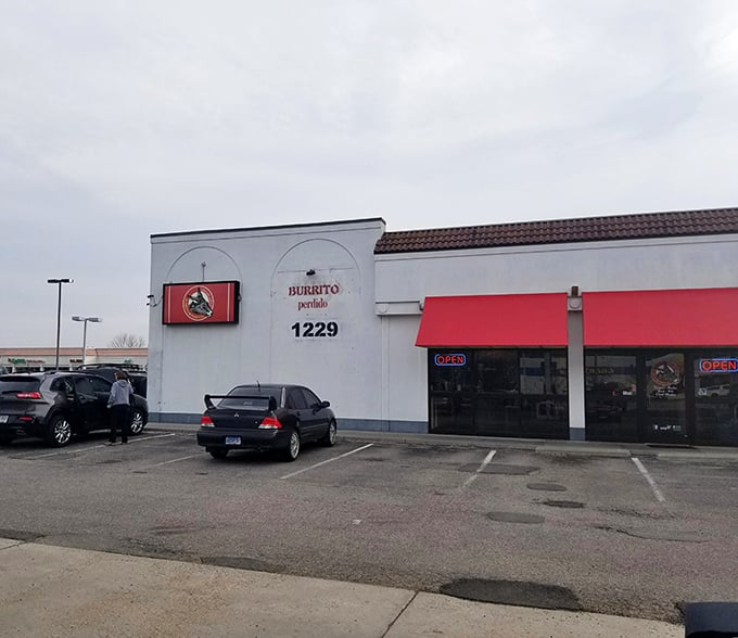The unassuming storefront that launched a thousand road trips. Like finding a diamond in a strip mall, Burrito Perdido's exterior promises culinary treasures within.