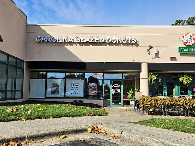 The unassuming storefront of Carolina Glazed Donuts might not stop traffic, but what's inside will stop you in your tracks. Sweet treasures await behind that modest exterior. 