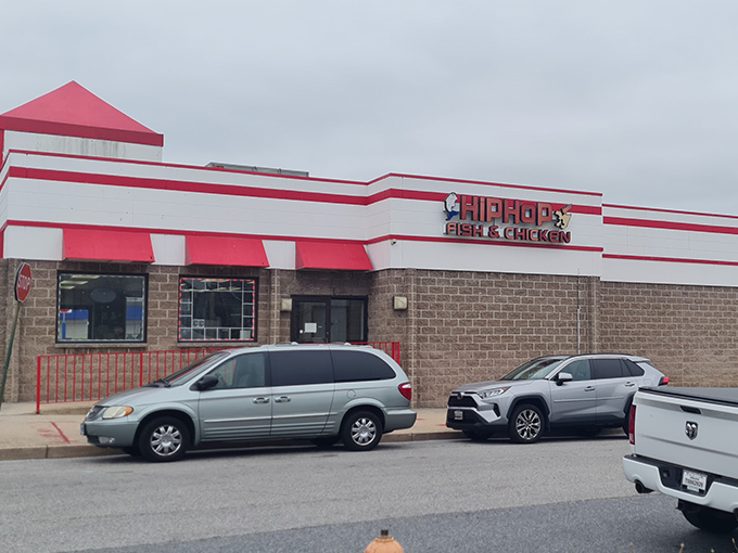 The red and white striped exterior of Hip Hop Fish & Chicken stands like a beacon of culinary promise on Baltimore's streets. Comfort food paradise awaits!