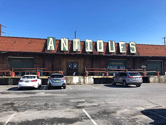 The weathered brick exterior with its vintage "ANTIQUES" sign promises treasures within—like a time capsule disguised as a building in Allentown.
