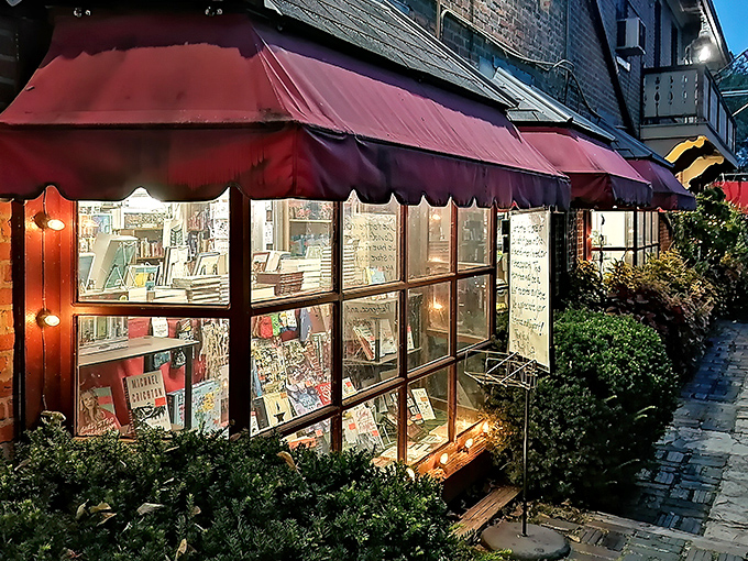 The iconic red awnings of The Book Loft glow like literary beacons at dusk, promising adventures within those brick walls and beckoning bibliophiles from across Ohio.