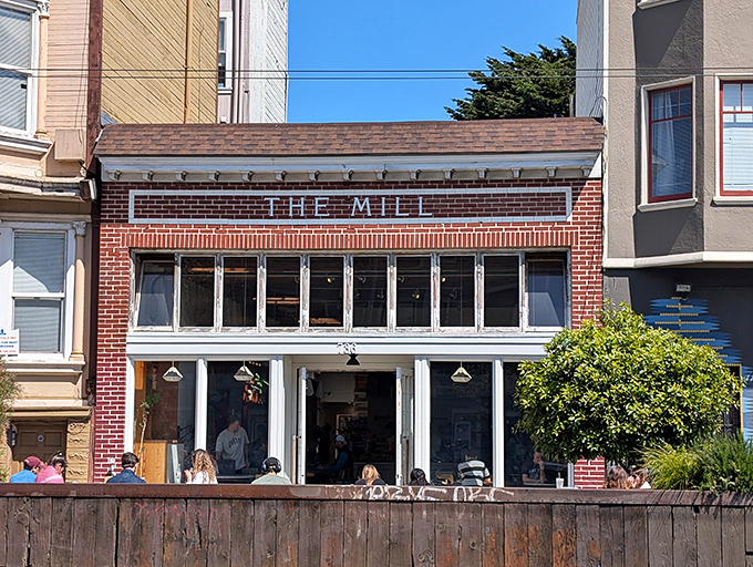 That brick facade with those gorgeous industrial windows? Pure San Francisco charm meets serious breakfast business. 