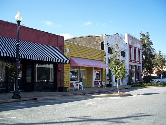 Main Street magic! These colorful storefronts aren't just buildings&mdash;they're time machines disguised as architecture, complete with charming awnings and small-town personality.