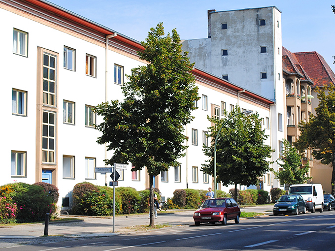 A modern urban setting with brick buildings and contemporary architecture.