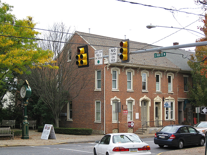 Historic brick buildings line Manheim's streets, where autumn leaves add splashes of gold to a scene that feels frozen in time yet wonderfully alive.