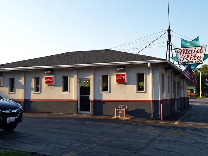 The iconic Maid-Rite sign beckons hungry travelers like a midwestern lighthouse, promising comfort food that's stood the test of time.