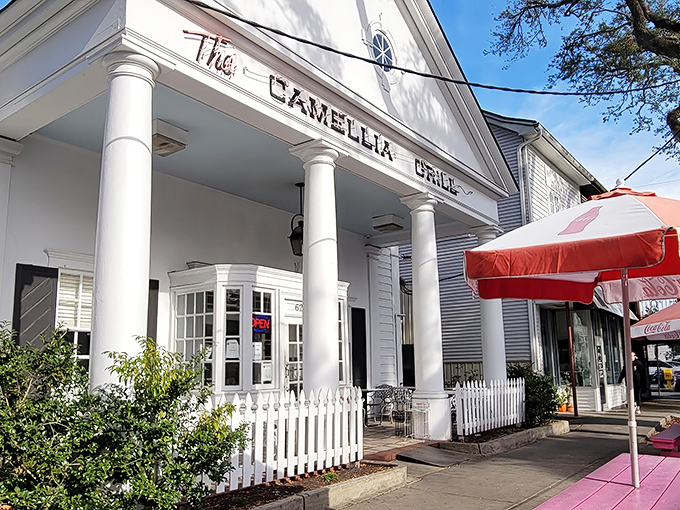 A Greek revival facade that houses burgers instead of philosophy&mdash;The Camellia Grill's columned entrance promises Southern hospitality with a side of architectural charm.