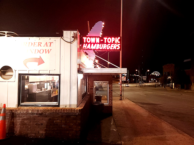 That neon glow isn't just a sign&mdash;it's a beacon of burger hope illuminating the Kansas City night, promising delicious salvation for hungry souls.